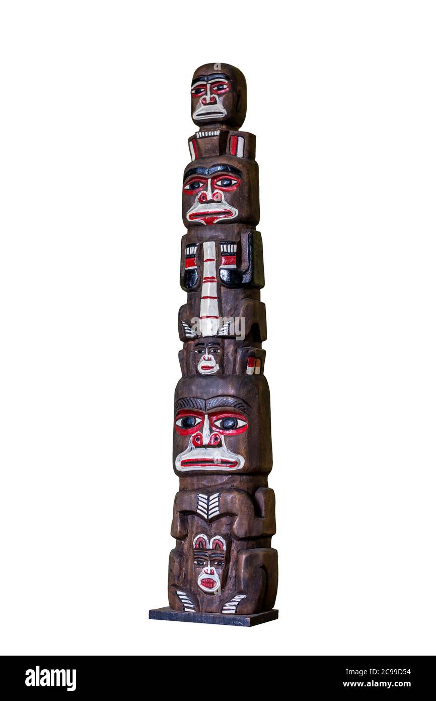 An ancient African wooden totem, carved and painted by hand. It depicts ...