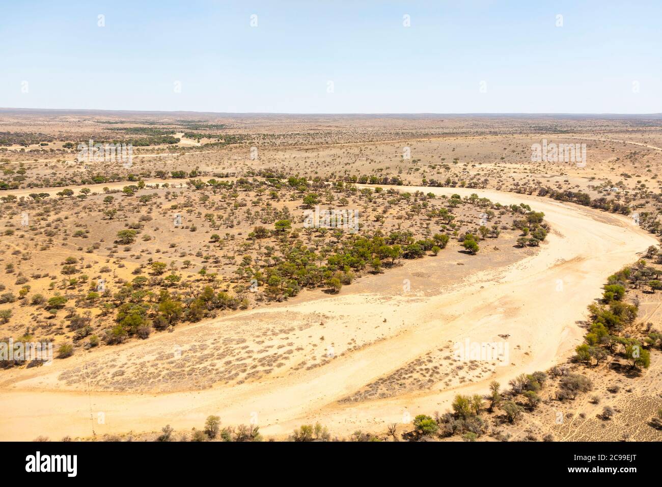 Typical bleak, arid terrain of the Namib Desert with sand filled river ...