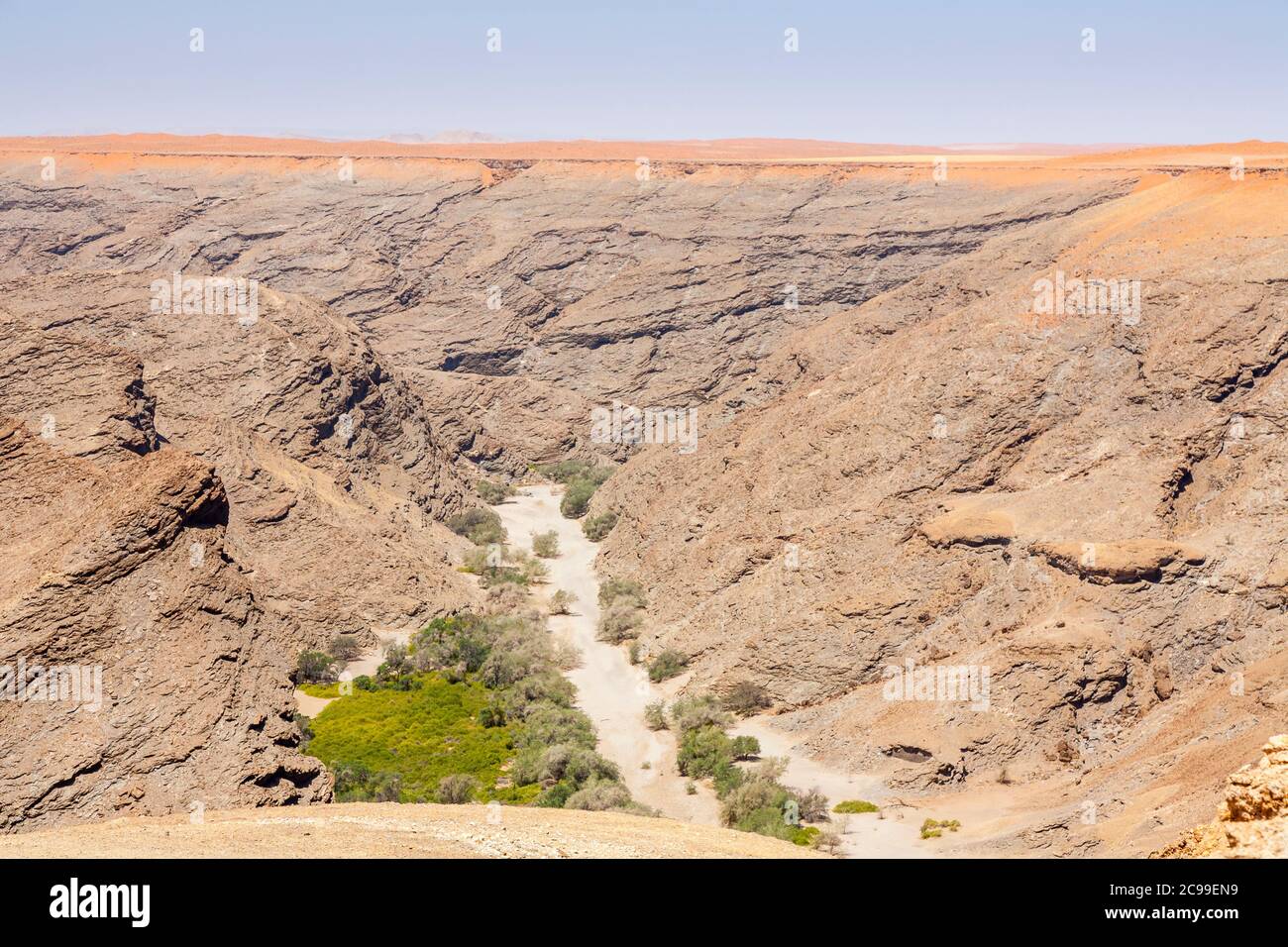 Typical bleak, arid stratified rock mountainous terrain and dried-up ...