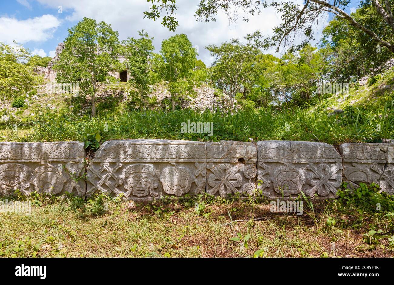 Details of wall carvings with a skull and crossed bones at Uxmal, an ...