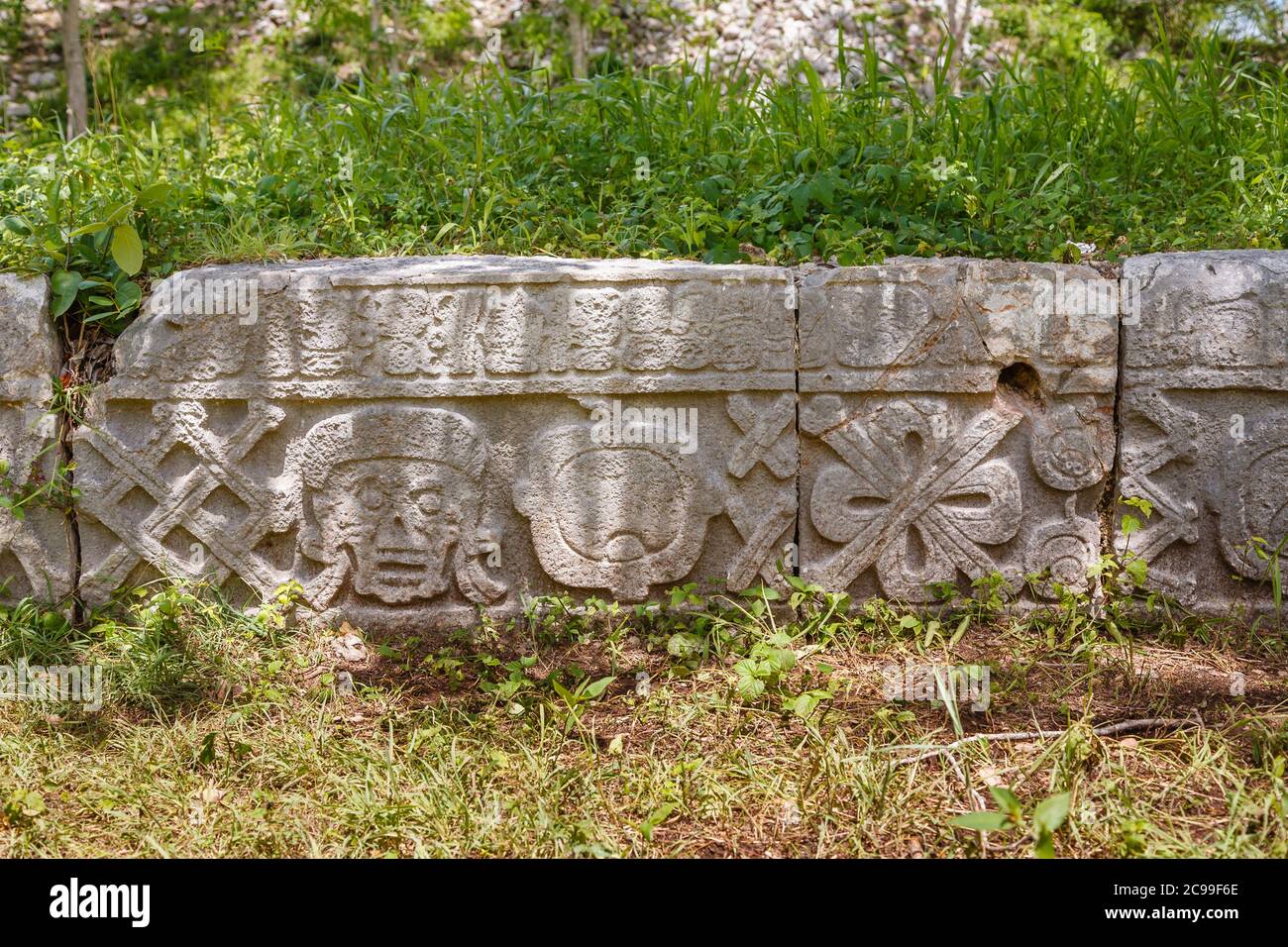 Details of wall carvings with a skull and crossed bones at Uxmal, an ...
