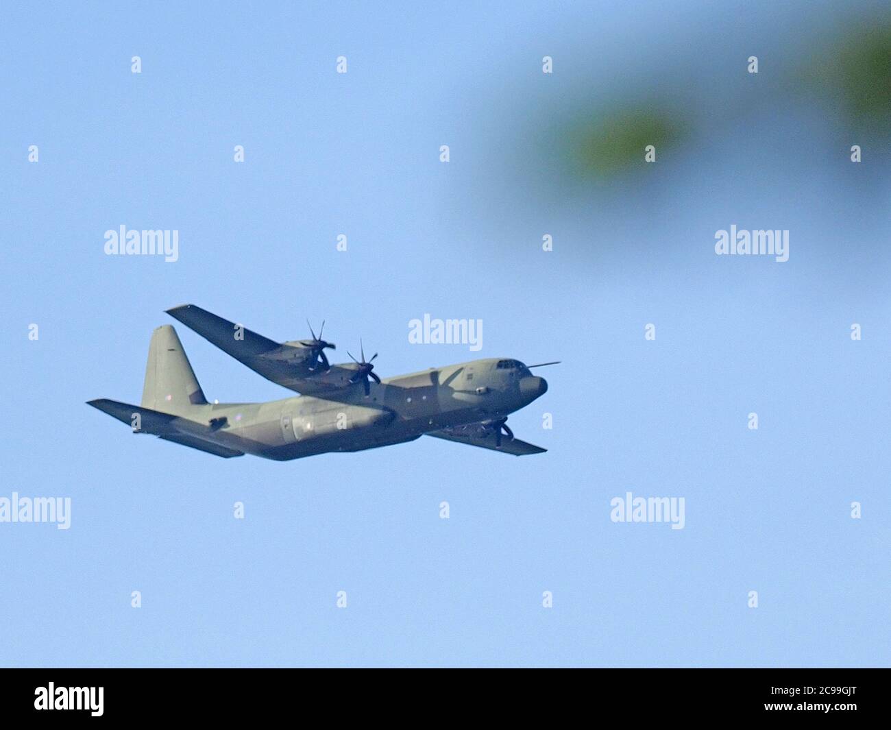 Low flying hercules transport plane hi-res stock photography and images ...