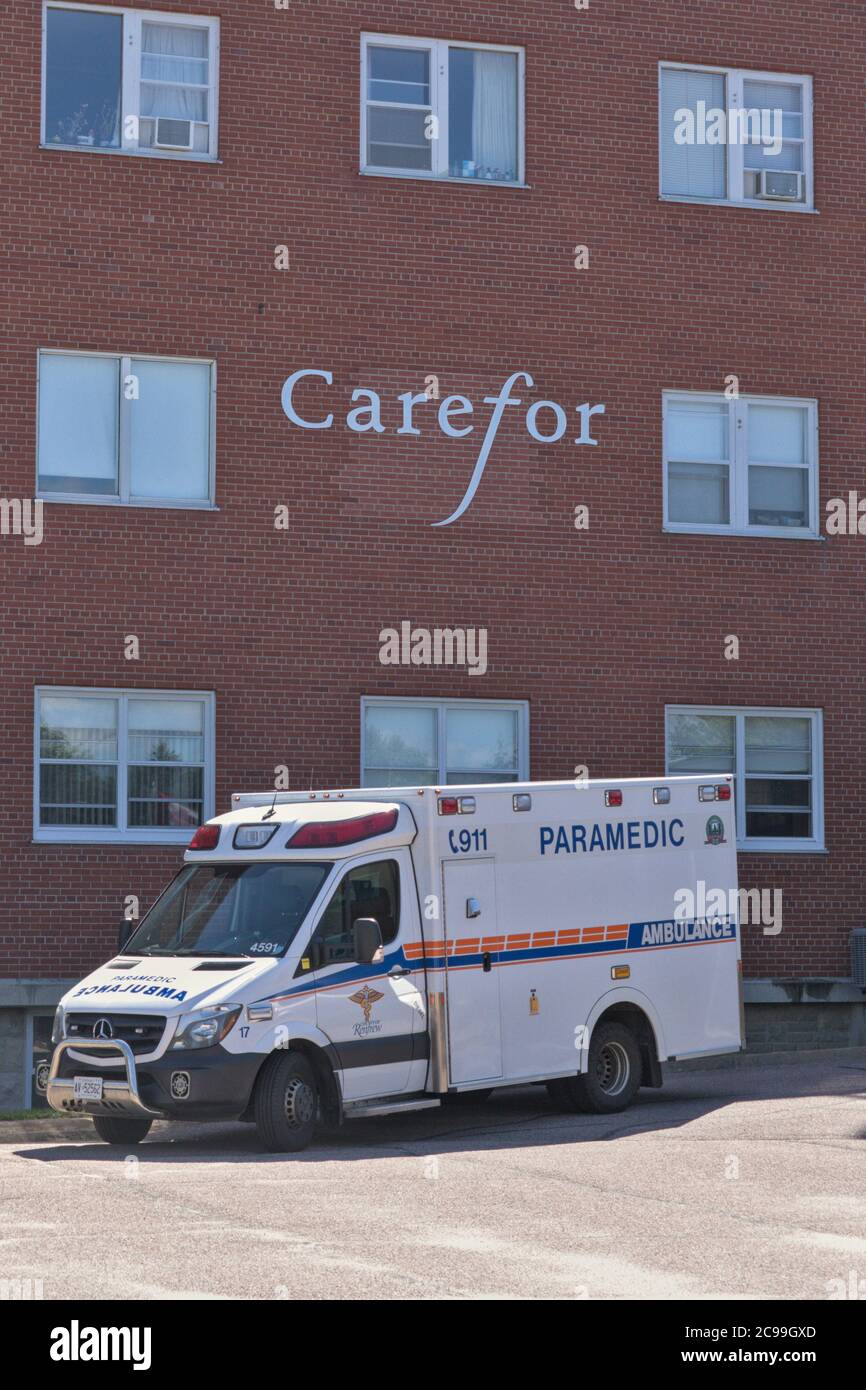 ambulance sitting outside carefor medical building Stock Photo - Alamy