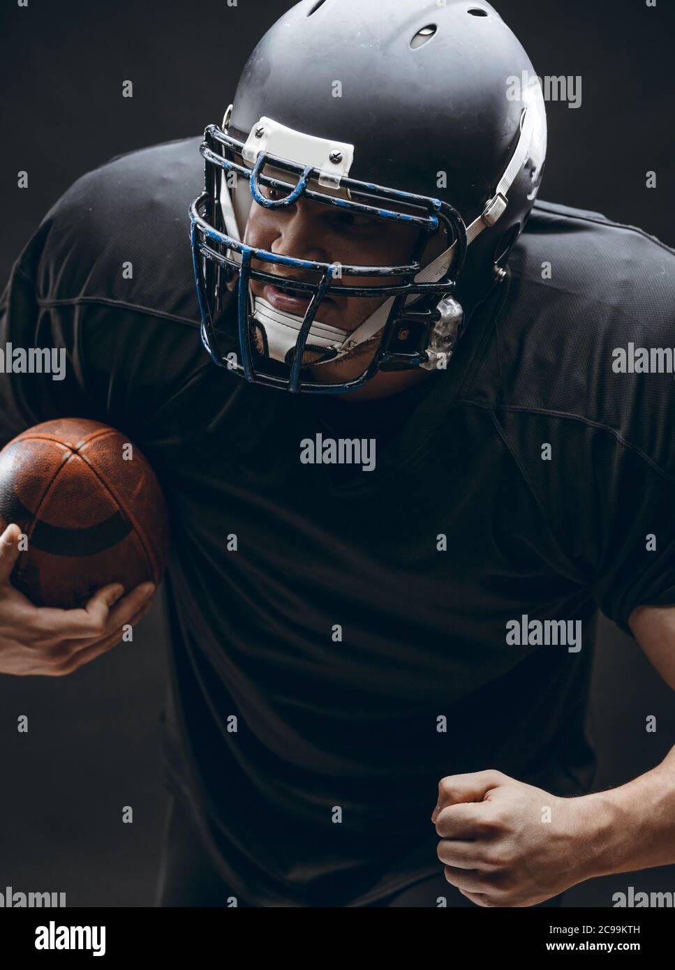 Handsome caucasian man wearing american football uniform and helmet ...