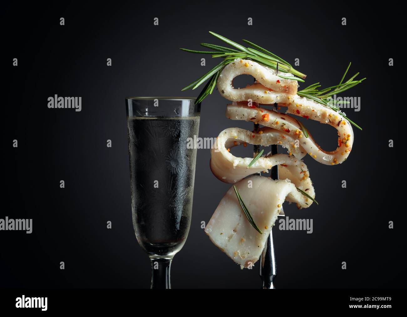 Frozen glass with cold vodka and slice of spicy salted lard. Lard with ...