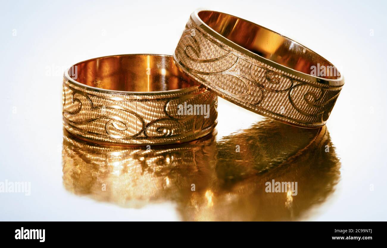 Two gold wedding rings with a thread on a white background Stock Photo ...