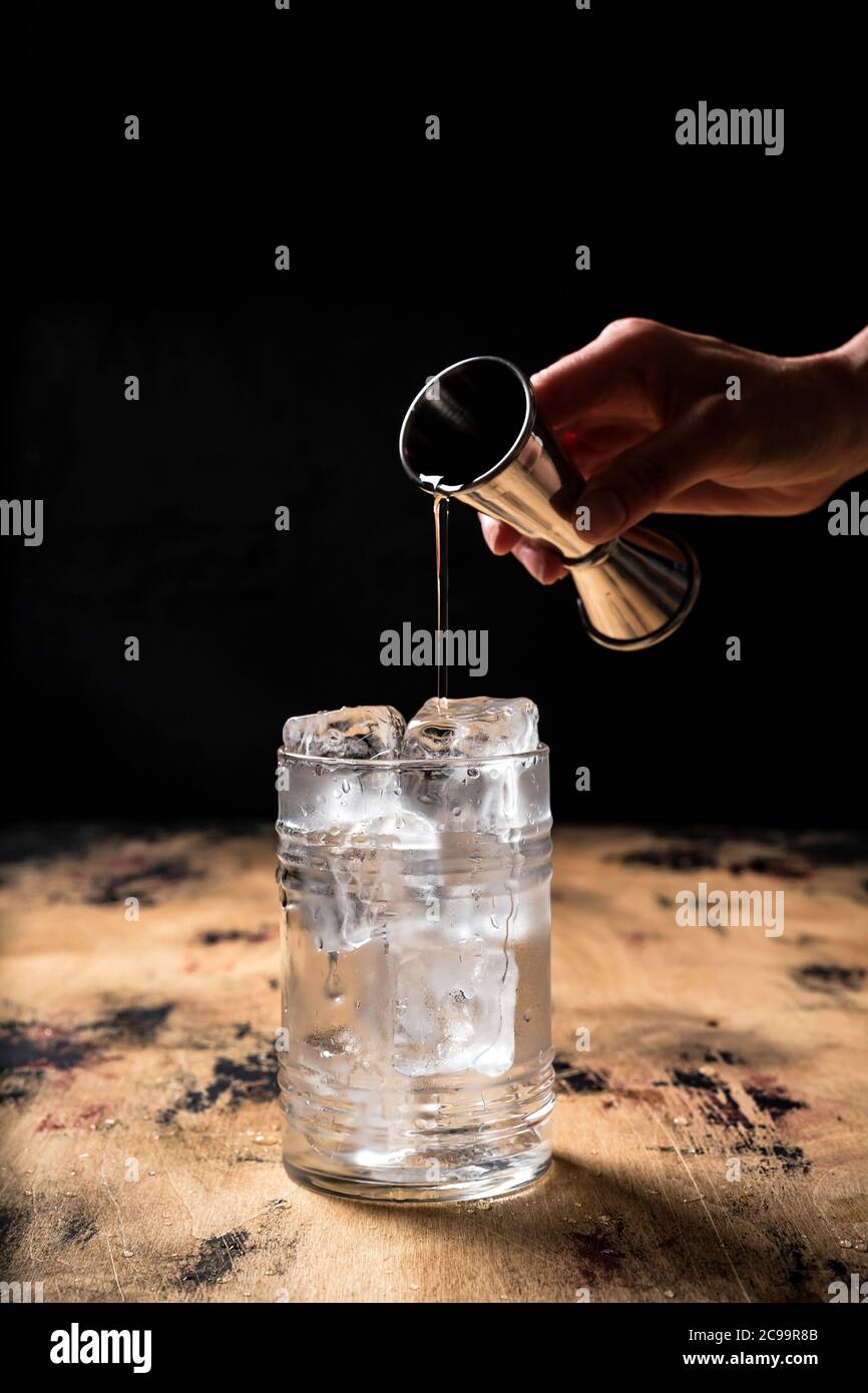 Pouring liquid jigger from black hi-res stock photography and images ...
