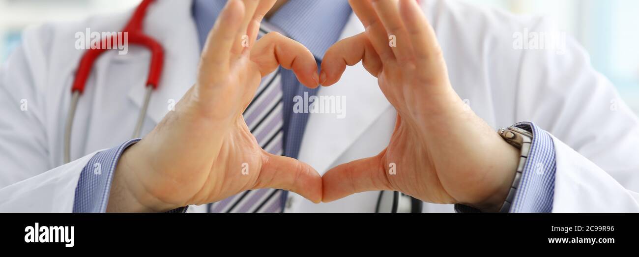Male medicine doctor hands showing heart shape Stock Photo - Alamy