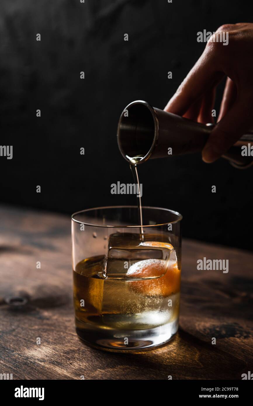 Pouring liquid from jigger glass hi-res stock photography and images ...