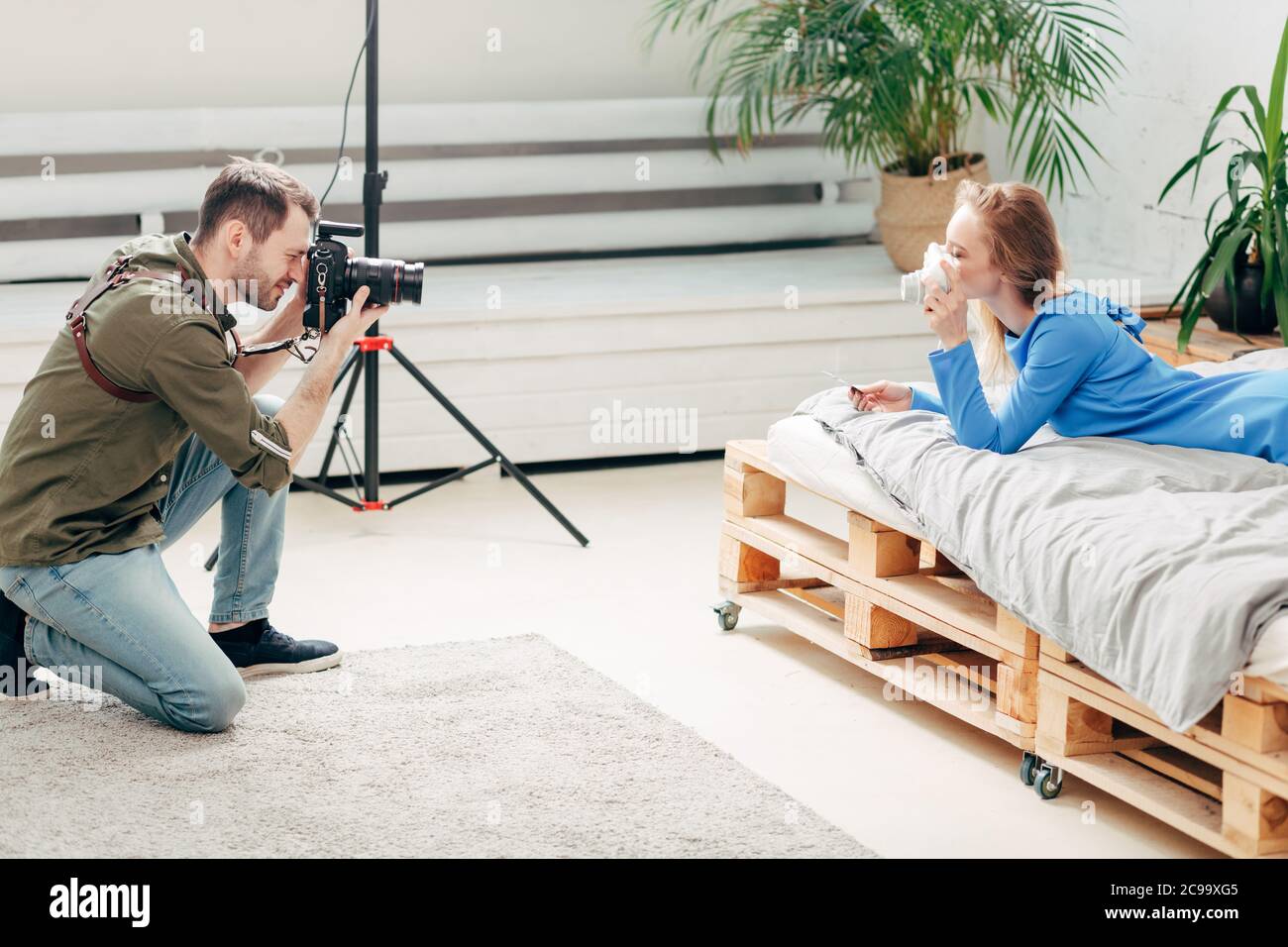 funny girl pretending that she is taking a photo while posing to the ...