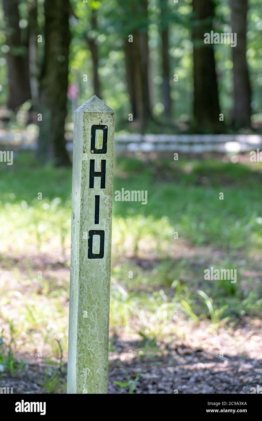 The name of the state Ohio engraved and painted black in a wood post ...