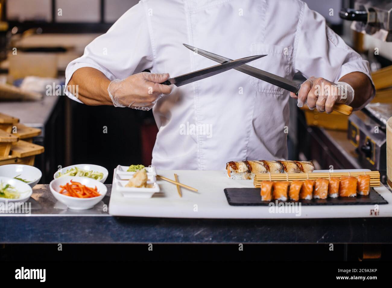 chef's hands with a knife. close up cropped photo. tool for cooking ...