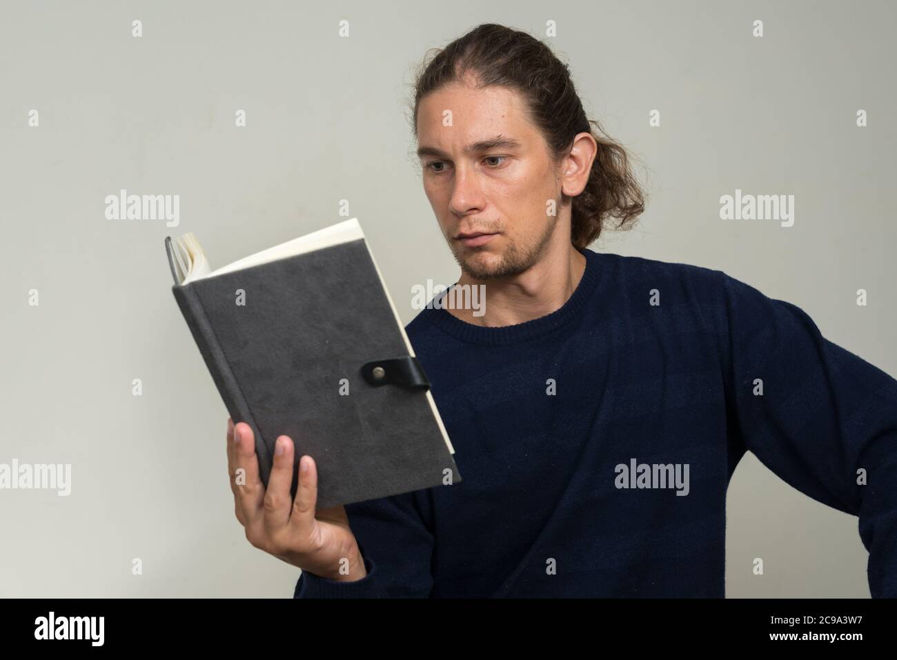 Portrait of handsome bearded man with long hair Stock Photo - Alamy