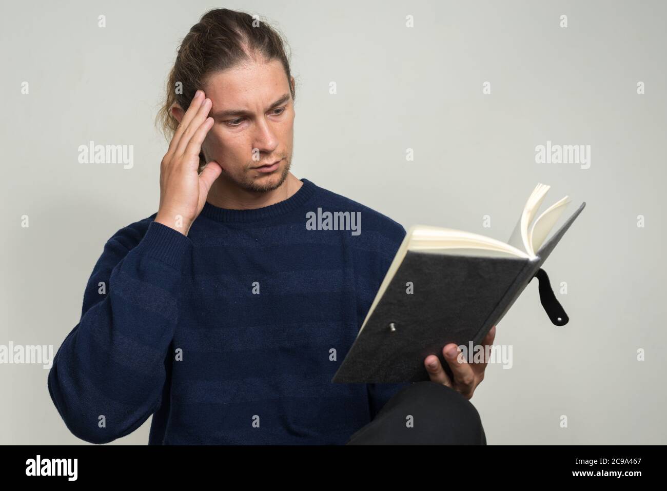 Portrait of handsome bearded man with long hair Stock Photo - Alamy