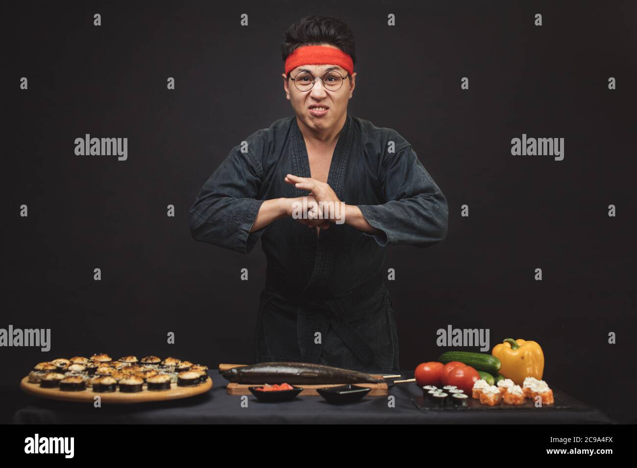 angry unhappy karate man standing in greeting pose of karate. close up ...
