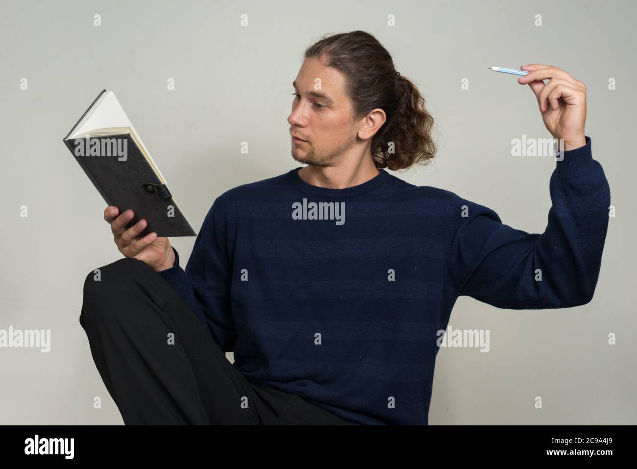 Portrait of handsome bearded man with long hair Stock Photo - Alamy