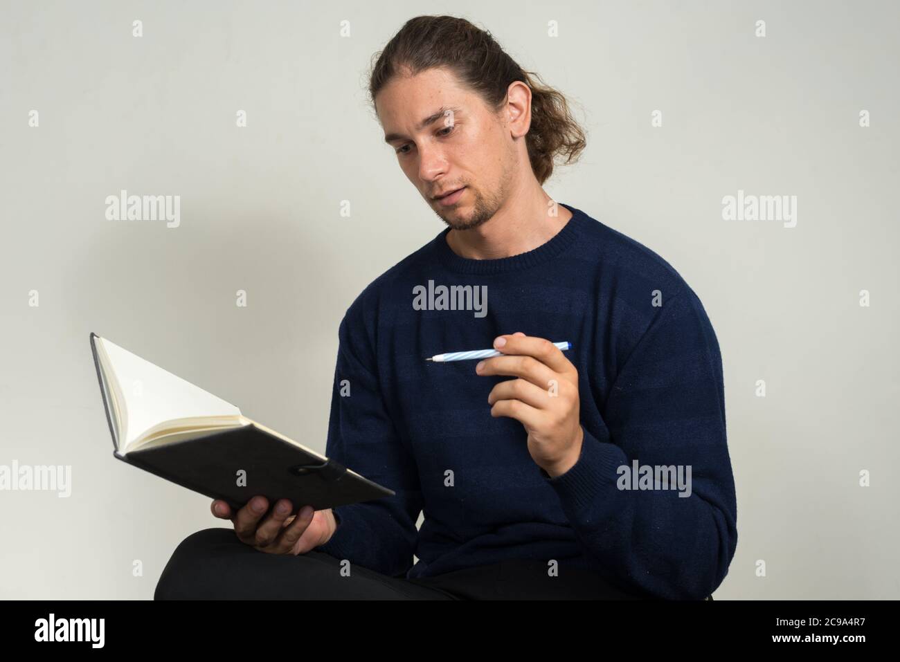 Portrait of handsome bearded man with long hair Stock Photo - Alamy
