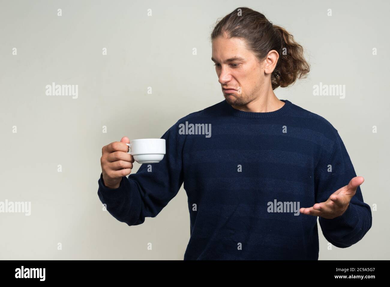 Portrait of handsome bearded man with long hair Stock Photo - Alamy