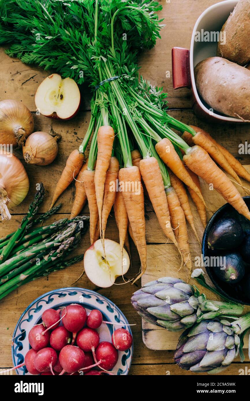 Vertical top view of fruits and vegetables on a wooden table Stock ...