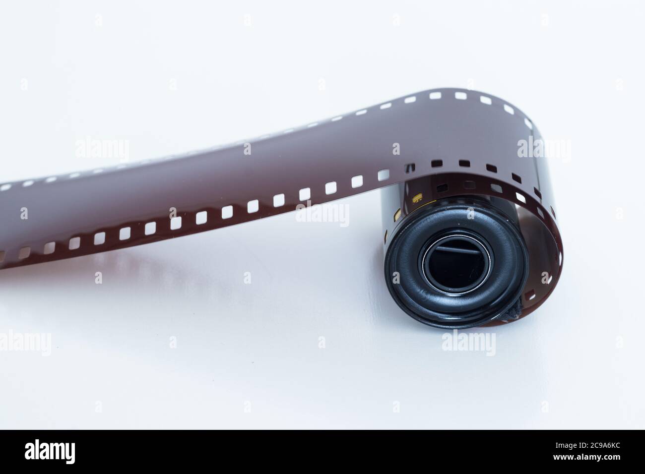 Photo roll-film camera isolated on white background. Photo film in ...