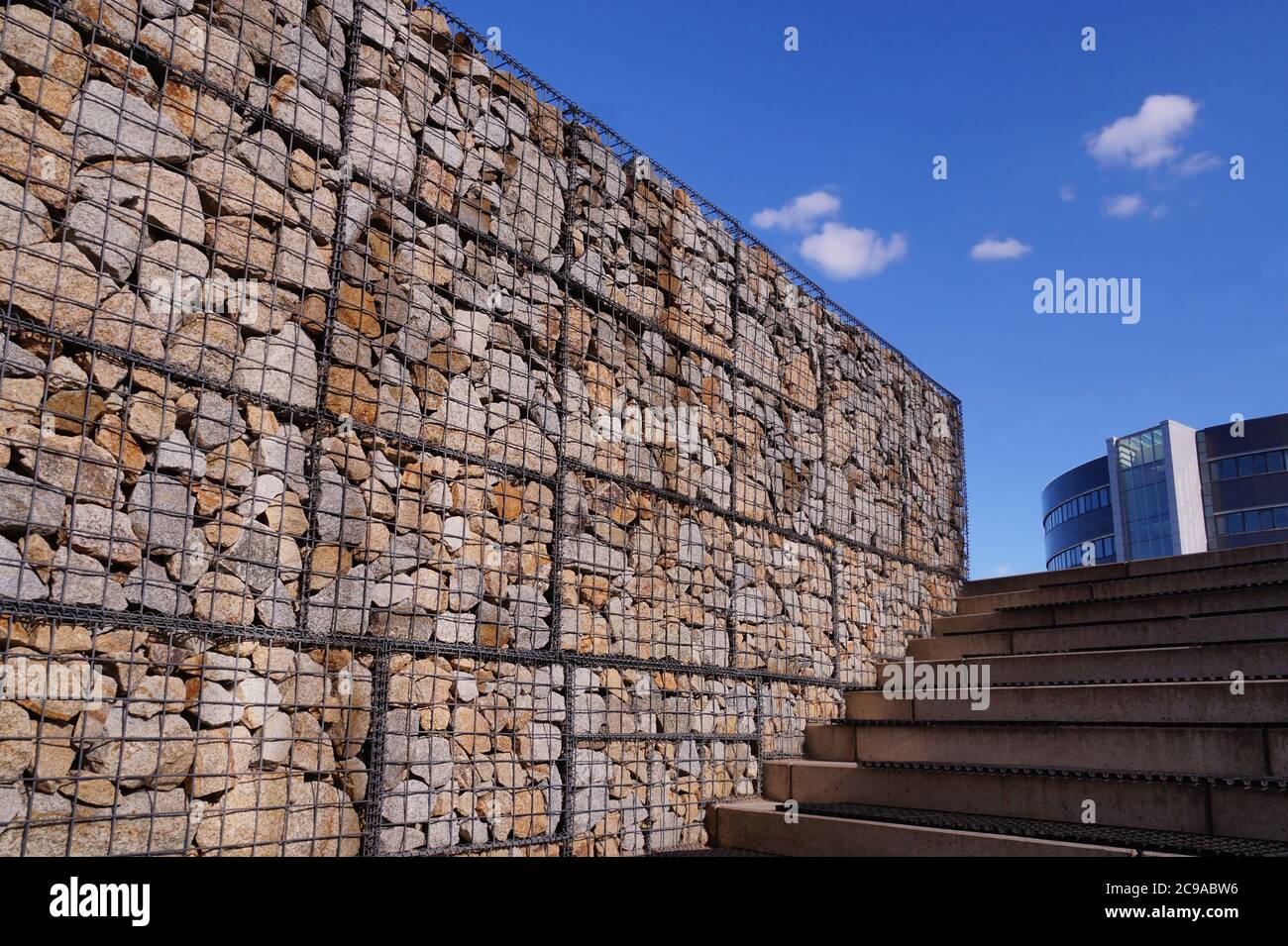 Urban architecture. The wall next to the stairs is made of gabions ...