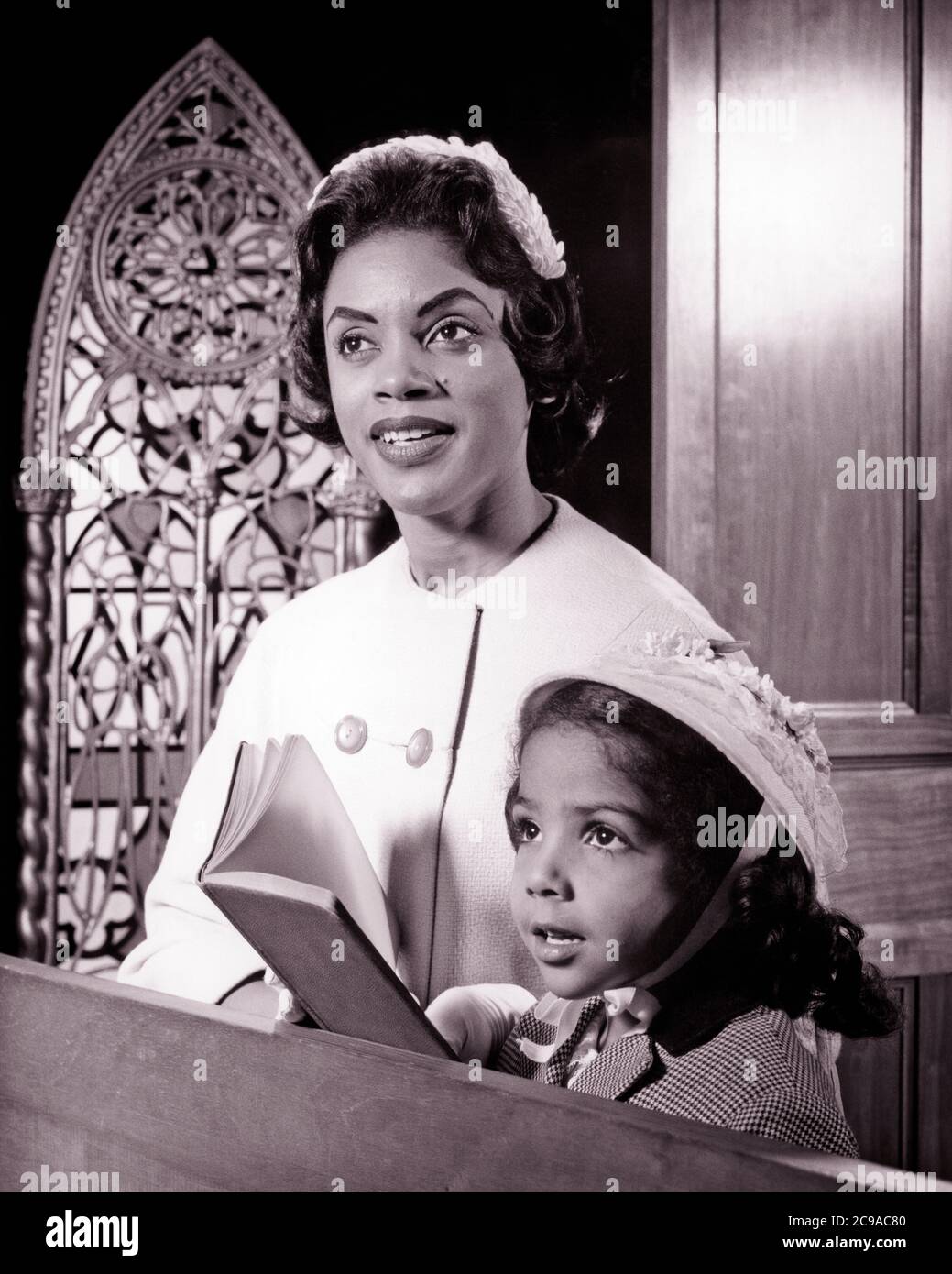 1960s DEVOTED DEVOUT AFRICAN-AMERICAN WOMAN AND GIRL CHILD MOTHER AND ...