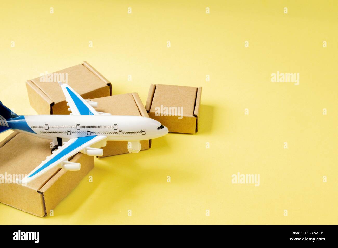 Airplane and stack of cardboard boxes. concept of air cargo and parcels ...