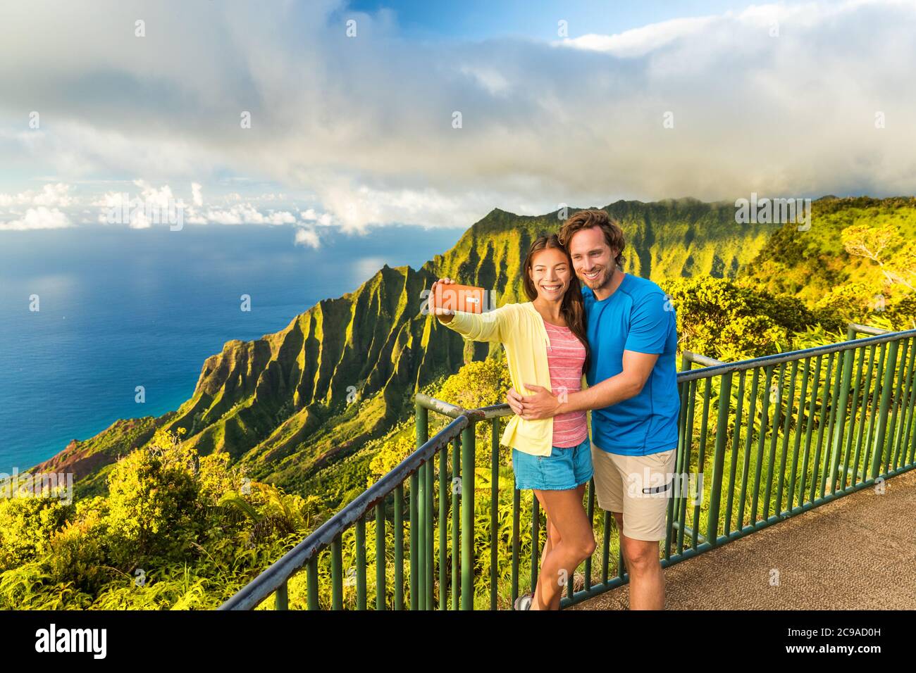 Hawaii selfie couple at Napali nature Kauai Hawaii. Young tourists ...