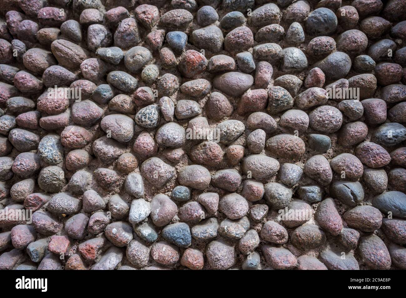 Abstract background of round cobblestones Stock Photo - Alamy