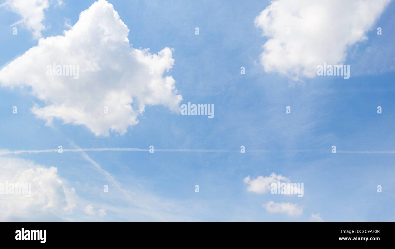 Airplane trails on blue sky. Contrails in the blue sky, sky with traces ...