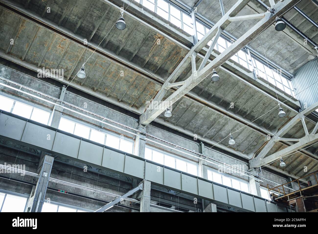 Low angle shot inside a huge factory Stock Photo - Alamy