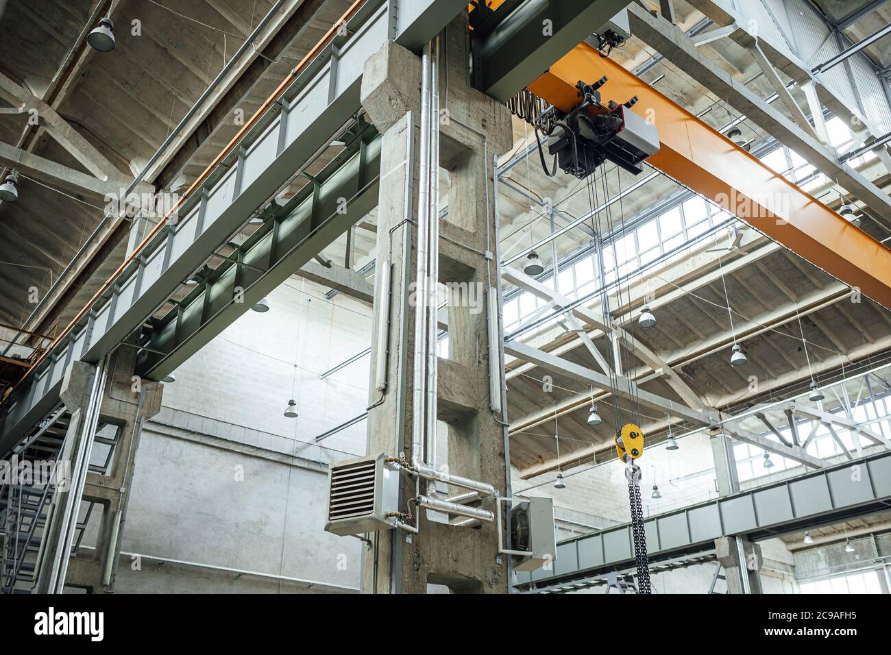 Low angle shot inside a huge factory Stock Photo - Alamy