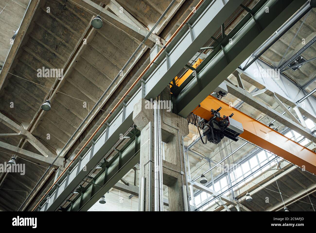 Low angle shot inside a huge factory Stock Photo - Alamy