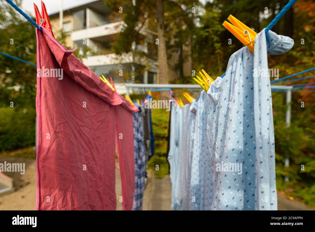 Portrait of clothes hanging to dry outdoors Stock Photo - Alamy