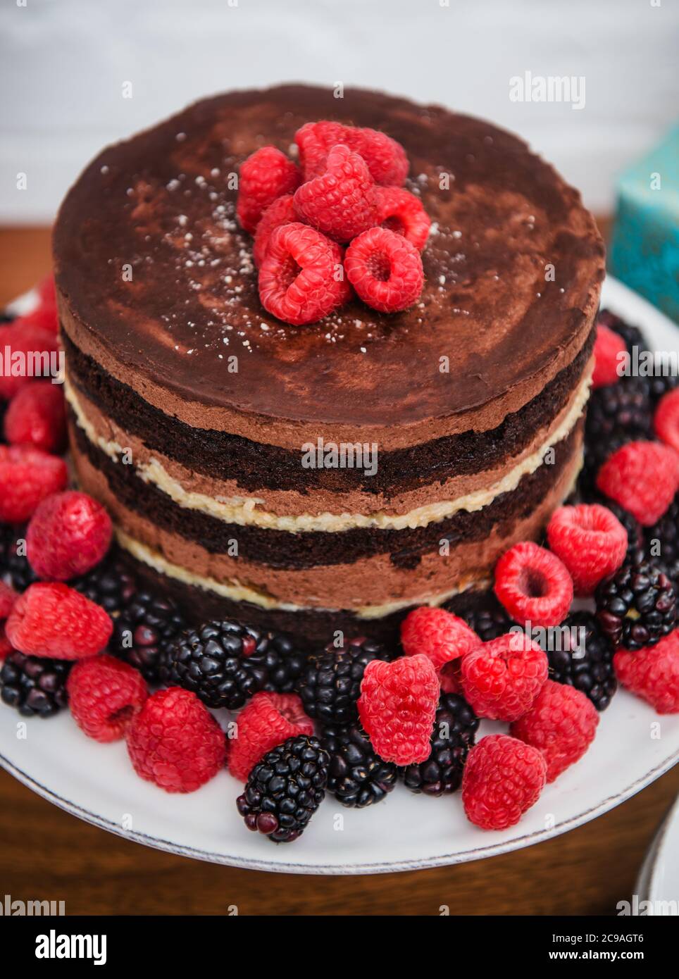 Layered Chocolate cake with berries Stock Photo - Alamy