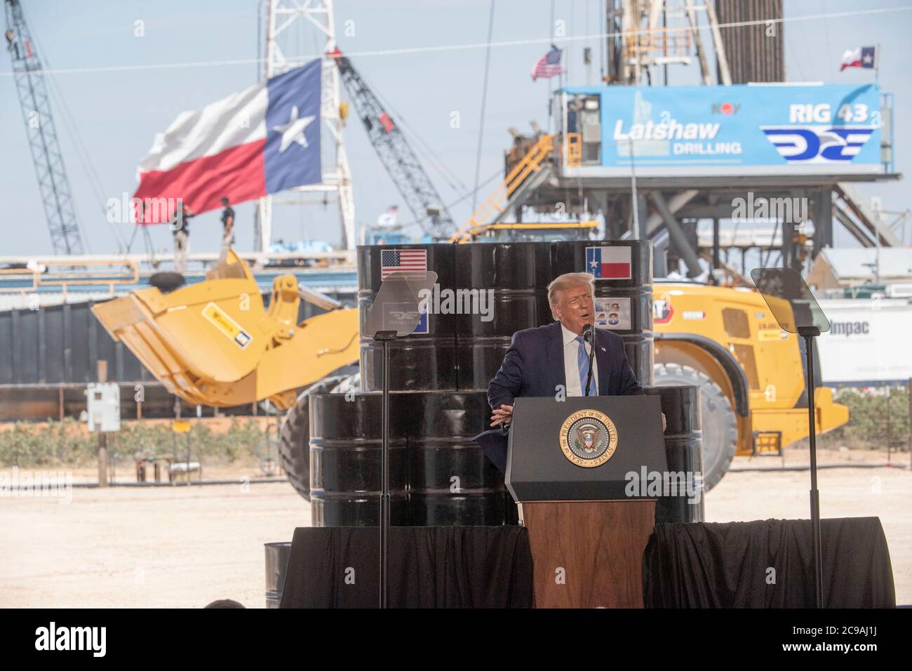 Midland, TX USA July 29, 2020: With black oil drums serving as a ...