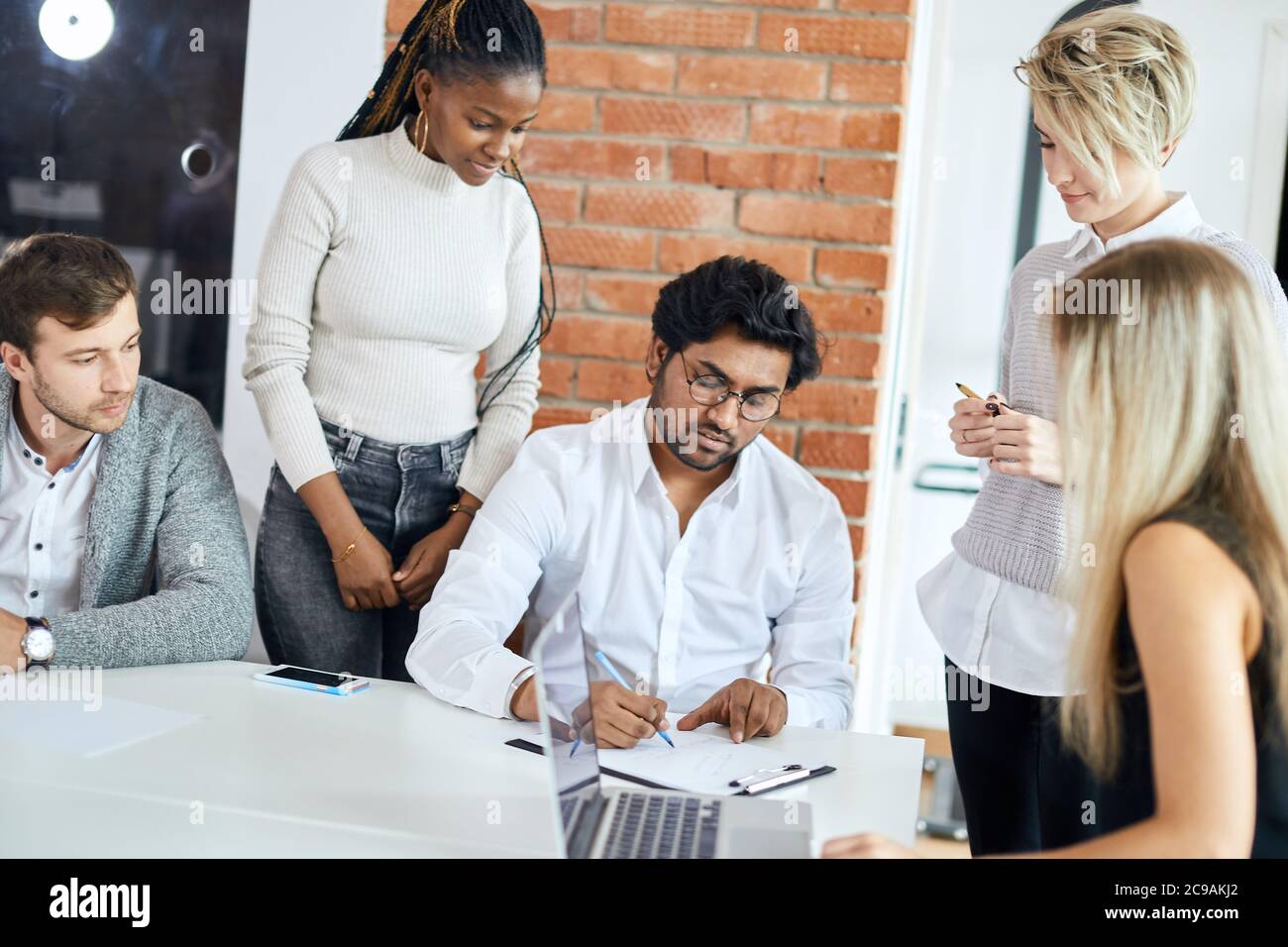 confident clever boss checking the work of his employees. close up ...