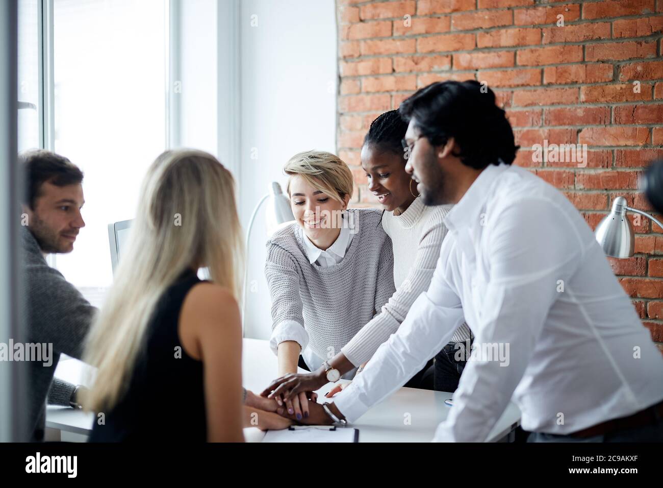 friendly young mixed race start up team. team work. friendship at work ...