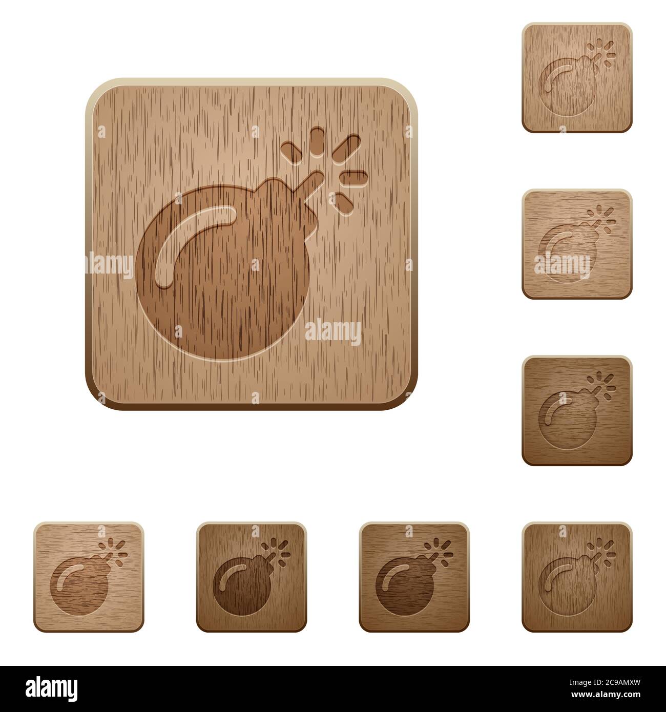Bomb with sparkling fuse on rounded square carved wooden button styles ...