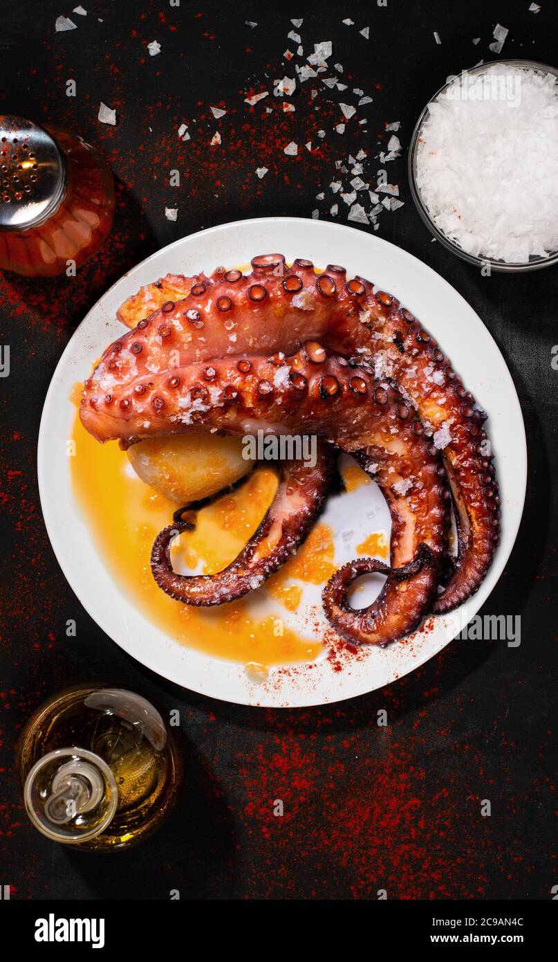 octopus dish with salt, oil and paprika vertical Stock Photo - Alamy