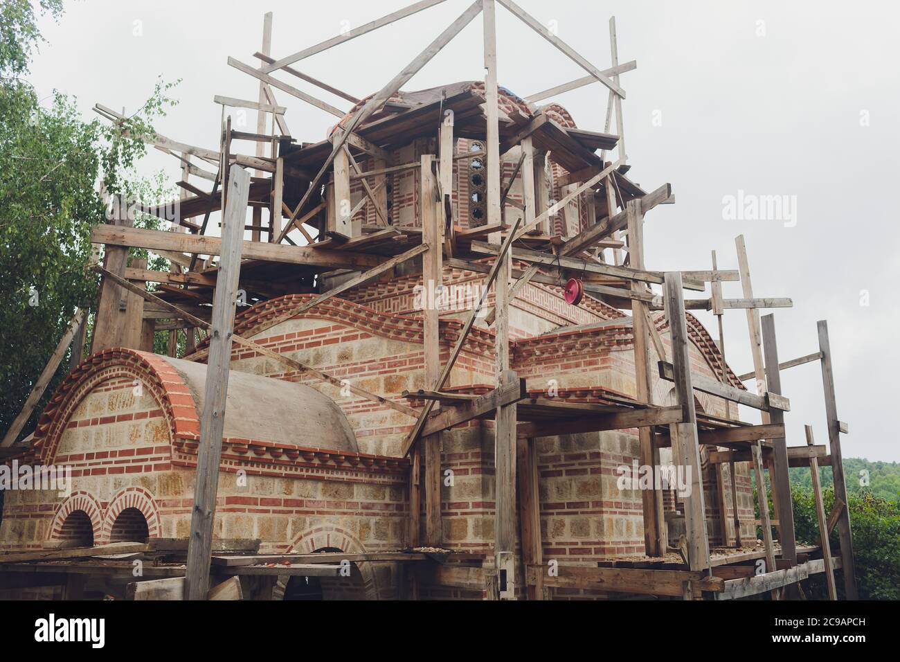 Construction of a new church in a modern style. Scaffolding around the ...