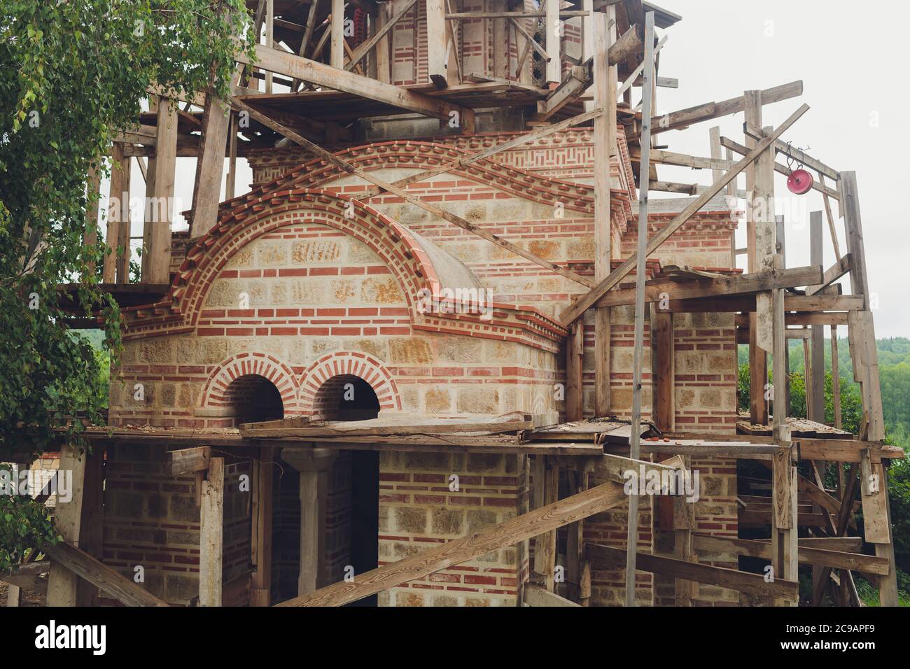 Construction of a new church in a modern style. Scaffolding around the ...
