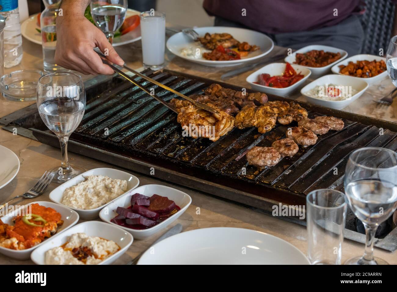 Different types of meat grilled on Barbecue on the table, Served with ...