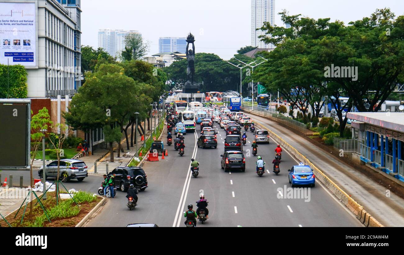 Jakarta, Indonesia - March 6, 2019: Traffic on Jalan Sudirman, near ...