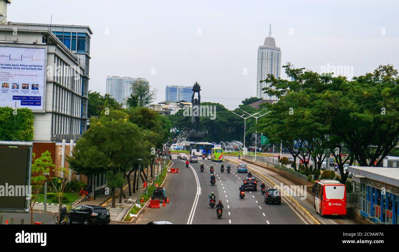Jakarta, Indonesia - March 6, 2019: Traffic on Jalan Sudirman, near ...