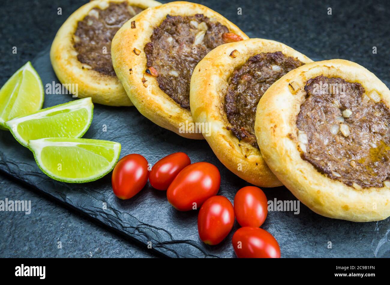 Delicious Lebanese (Arabic) food, genuine sfihas on a slate plate with ...