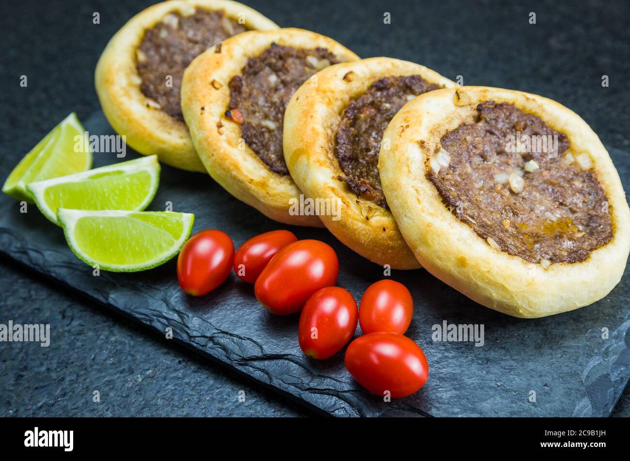 Delicious Lebanese (Arabic) food, genuine sfihas on a slate plate with ...