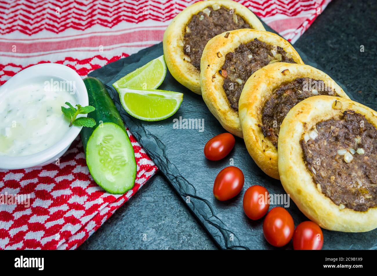 Delicious Lebanese (Arabic) food, genuine sfihas on a slate plate with ...