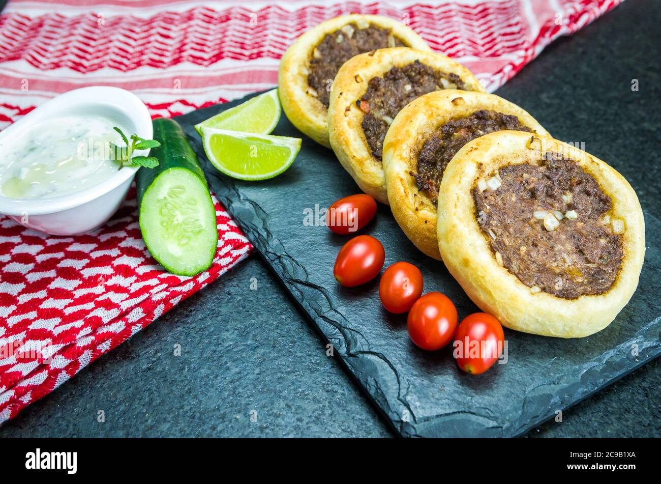 Delicious Lebanese (Arabic) food, genuine sfihas on a slate plate with ...