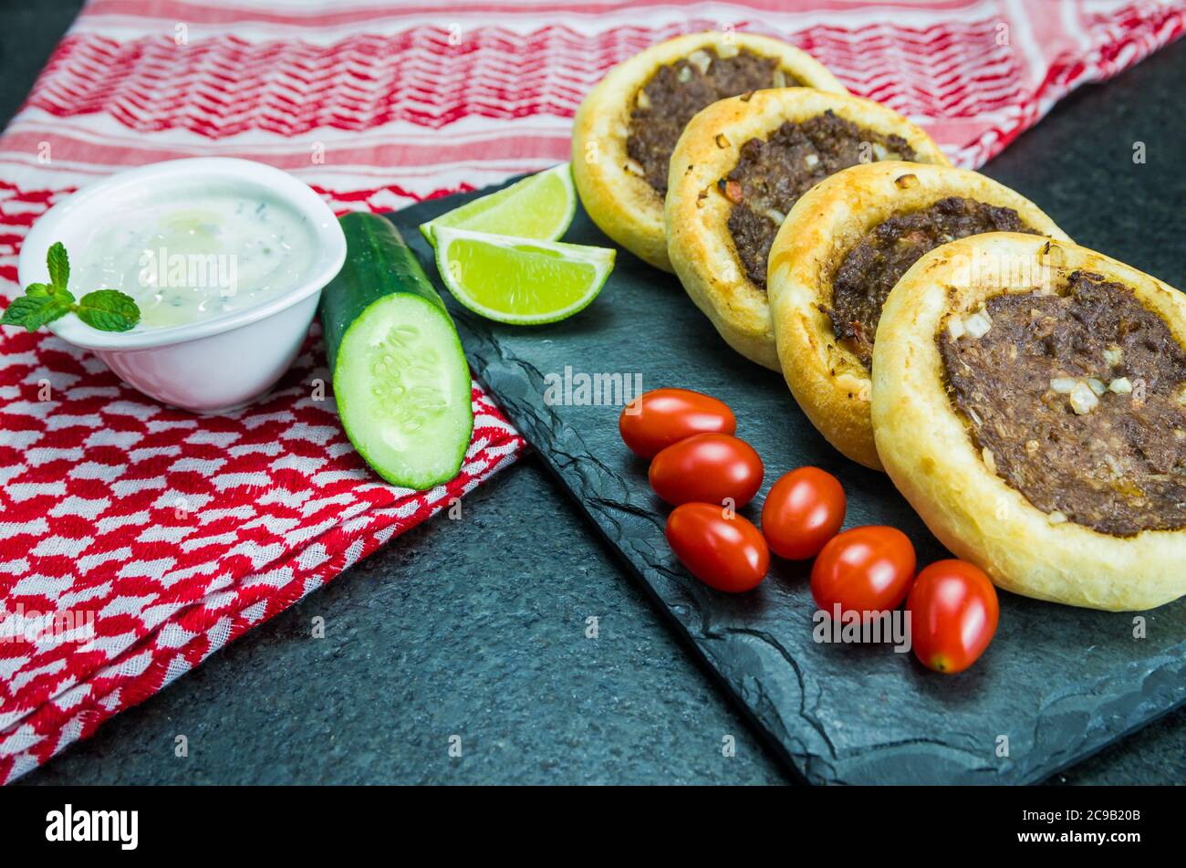 Delicious Lebanese (Arabic) food, genuine sfihas on a slate plate with ...